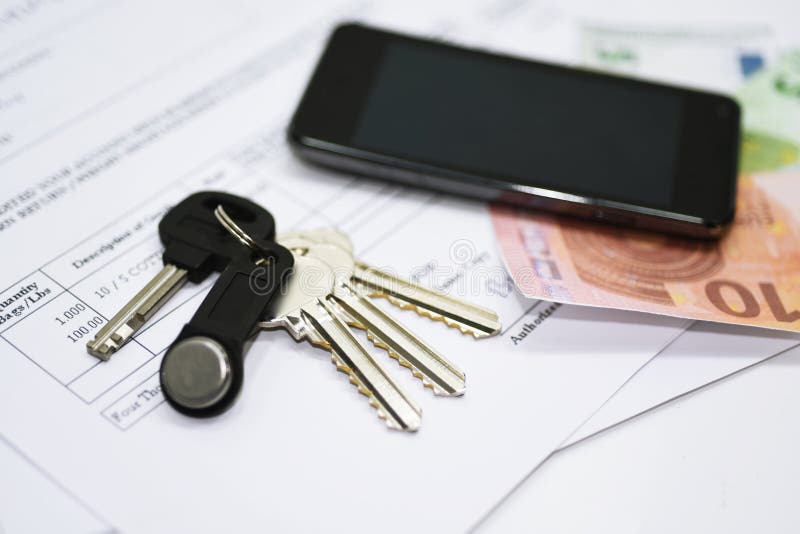 House Keys on Documents with Mobile Phone Stock Image - Image of ...