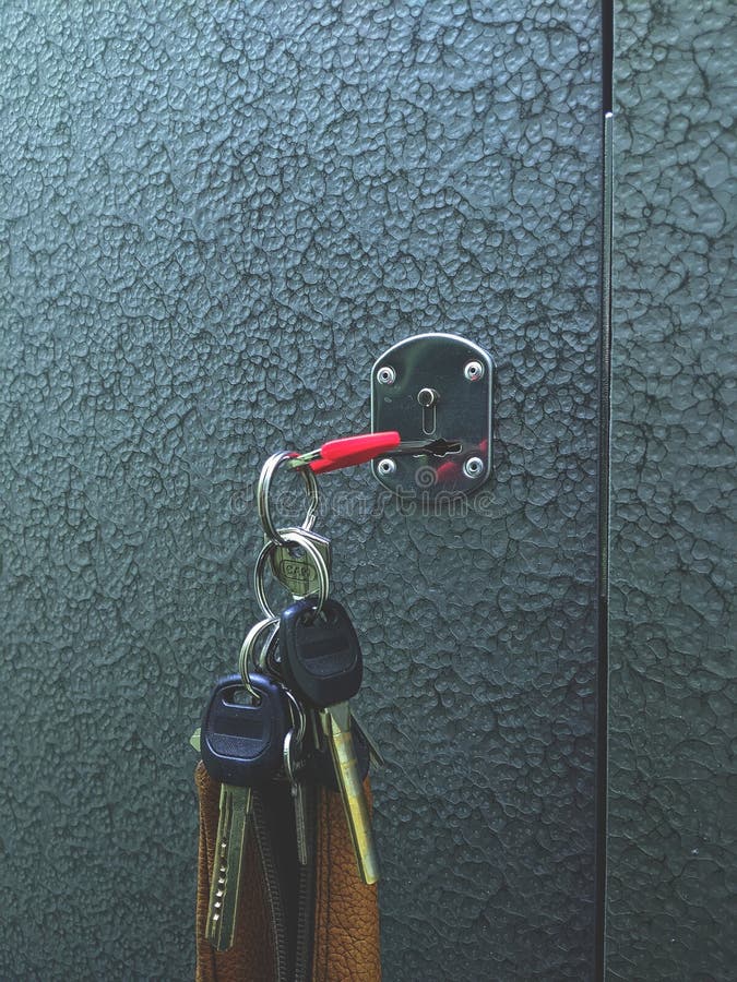 House Keys from the Door in the Keyhole Editorial Photography - Image ...