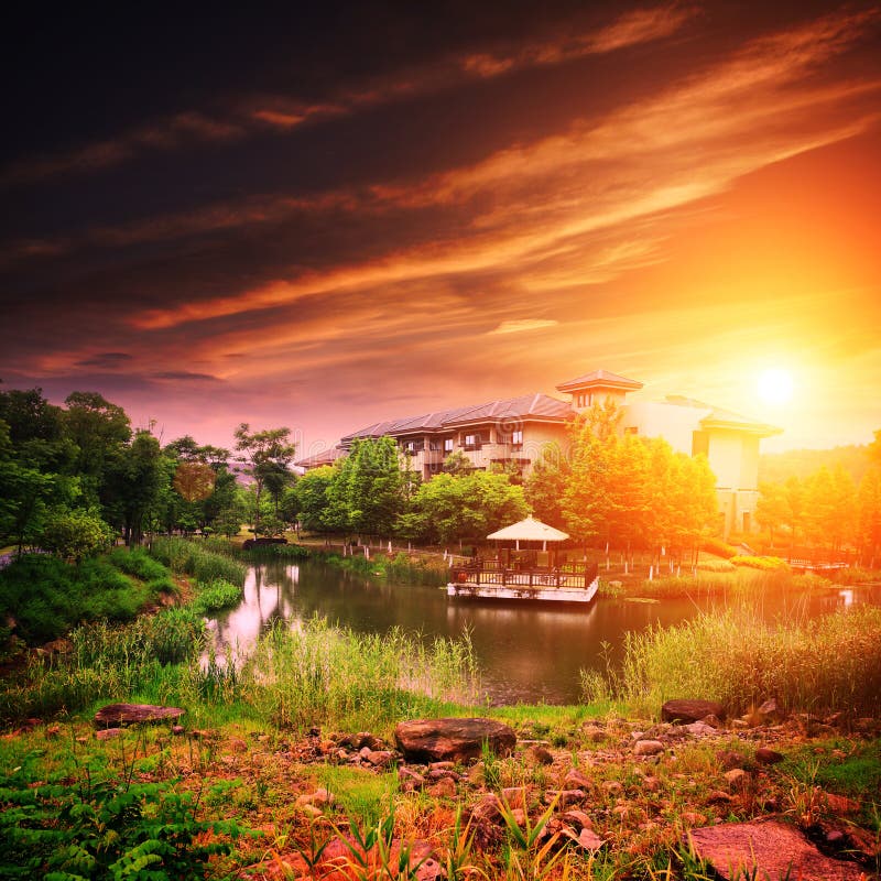 House on lake with sunset stock photo. Image of estate - 19778368