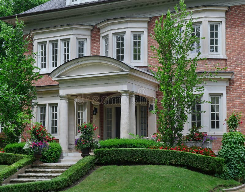 House with large portico stock photo. Image of shrub - 120137828