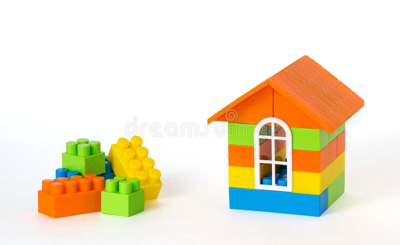 House Made of Plastic Bricks and Some Blocks Aside. Isolated on White ...