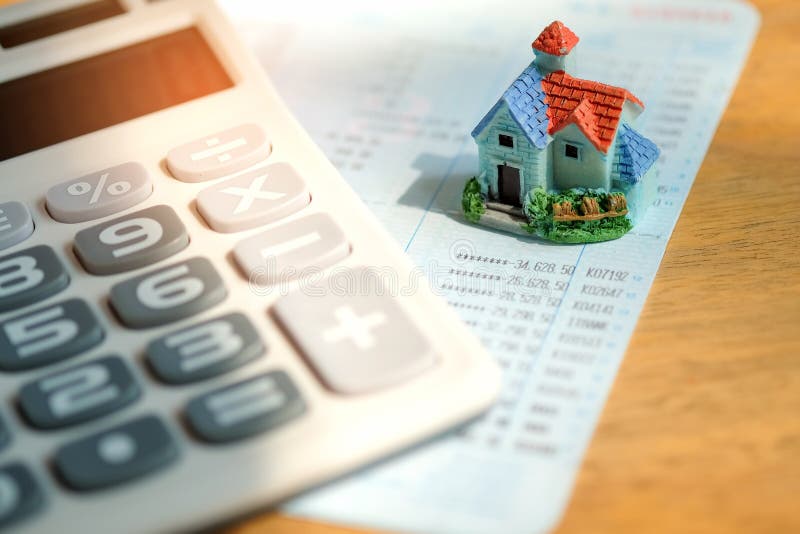 House Model with Calculator on Book Bank. Stock Photo - Image of ...
