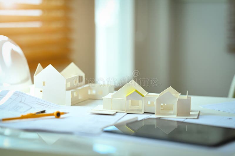 House Model, Compass and Blueprints on Architectural Workstation ...