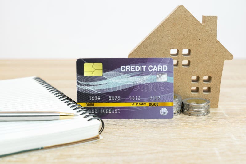 House Model and Credit Card on Table with Note Pad Stock Image - Image ...