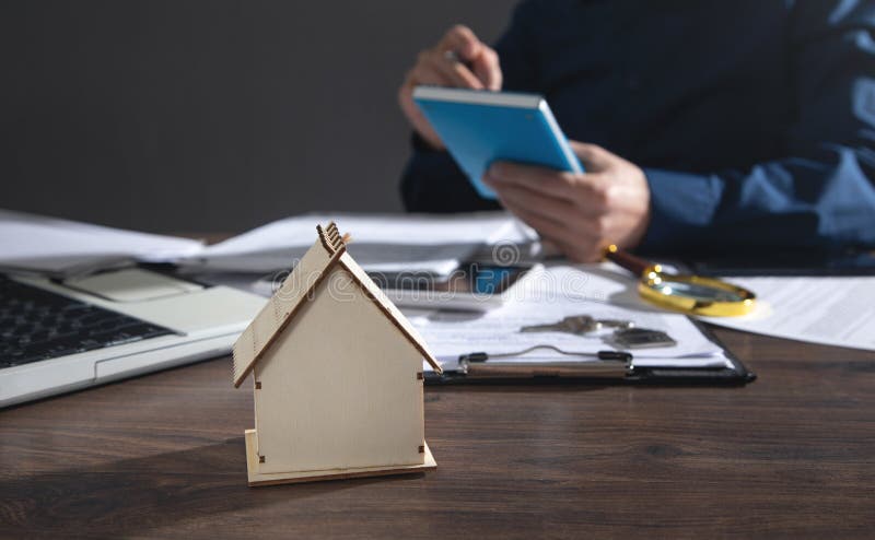 House Model on the Desk. Real Estate Agent Working at Office Stock ...