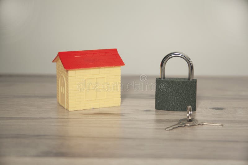 House Model on Lock and Key Stock Photo - Image of lock, metal: 217118994