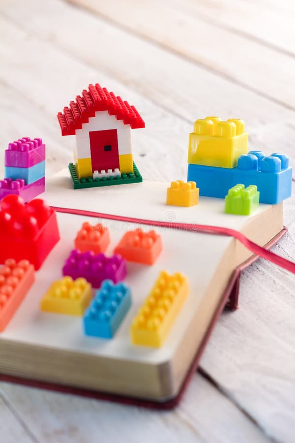 House Model with Plastic Toys on Notebook Stock Image - Image of house ...