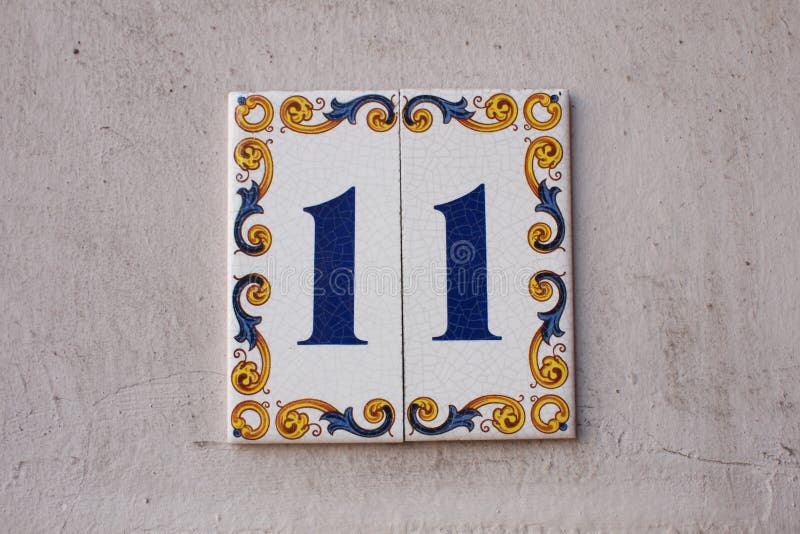 House Number "11" Attached To a Wall Stock Photo - Image of attached ...