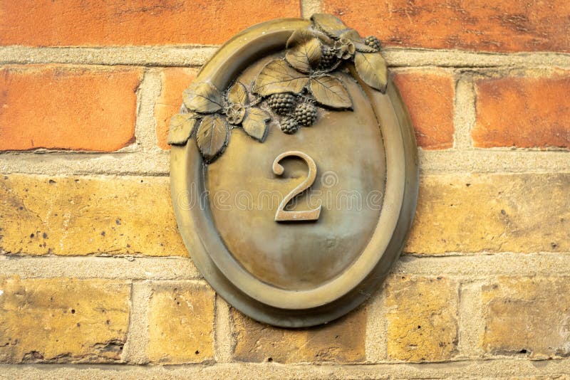 House Number 47 on a White Plaque on a Dark Green Wooden Front Door ...