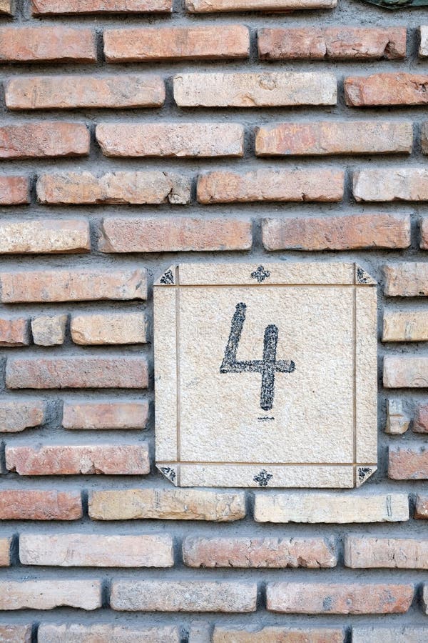 House Number 4 on Flat Brick Wall Stock Image - Image of tile, recessed ...