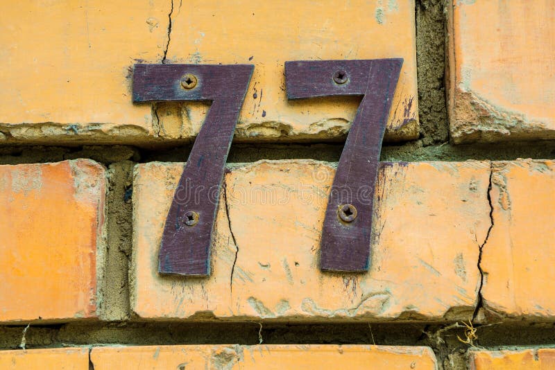 House Number 77 Made of Iron on a Brick Wall Stock Image - Image of ...