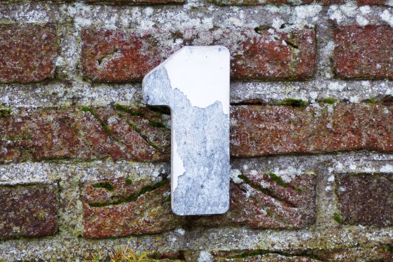 Peeling house number one stock photo. Image of grey - 342685708