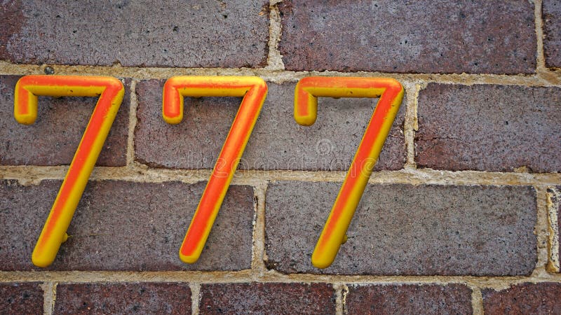 House Number Seven Hundred and Seventy Seven 777 on Brick Wall ...