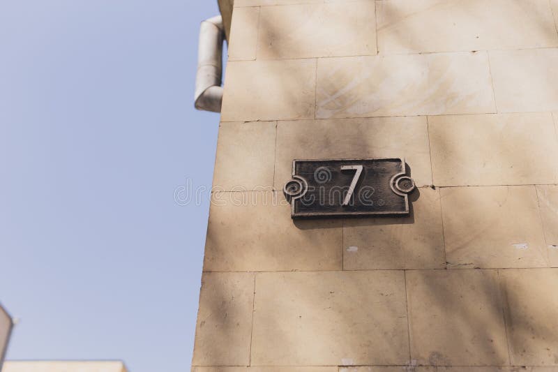 House Number Seven 7 Sign on Stone Wall Stock Image - Image of license ...