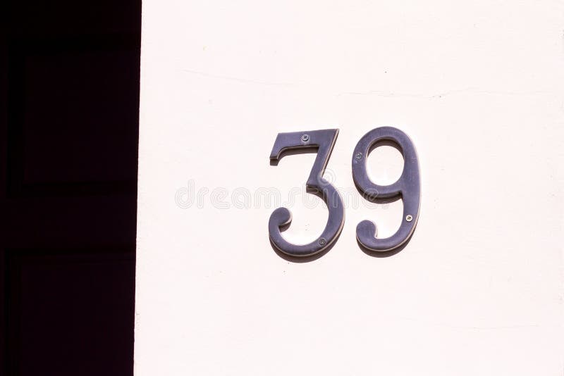 House Number 39 Slanted on a White Wall Stock Photo - Image of black ...
