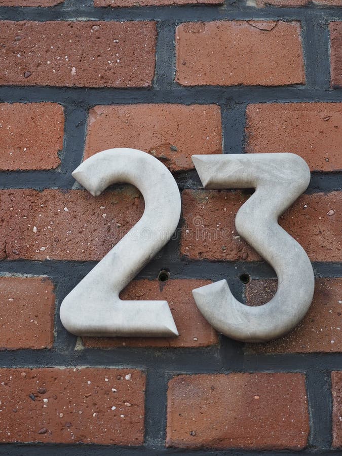 House Number 23, White Numbers on a Clinker Wall Stock Image - Image of ...