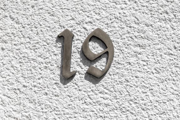 House Number 19 at a White Wall Stock Photo - Image of detail, pattern ...