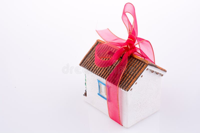 House with a ribbon stock photo. Image of icon, loan - 66714920