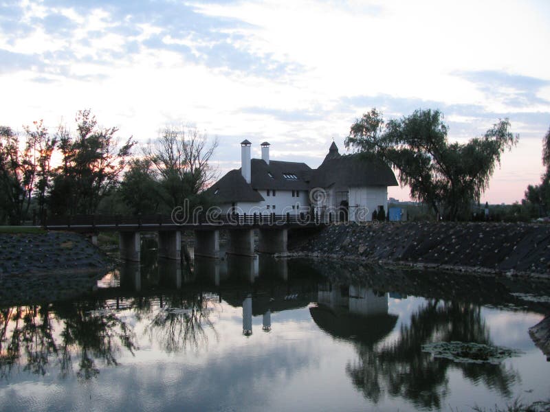 House on the river bank stock image. Image of stands - 133925669