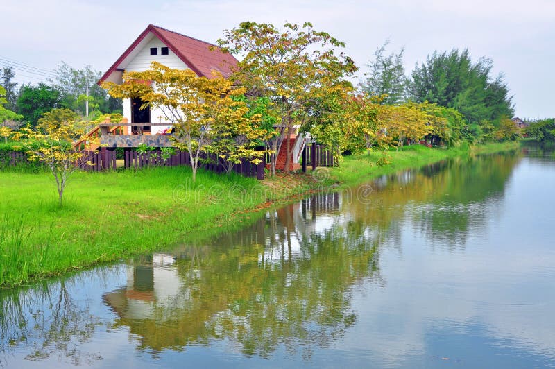 House is in the riverside. stock photo. Image of green - 27337200