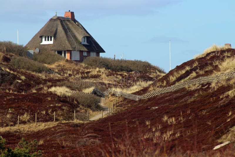 House and sand dunes stock image. Image of scenic, blue - 151731579