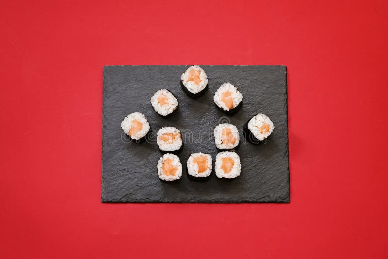 House Shape Sushi Rolls on Red Background with Copy Space. Ordering ...