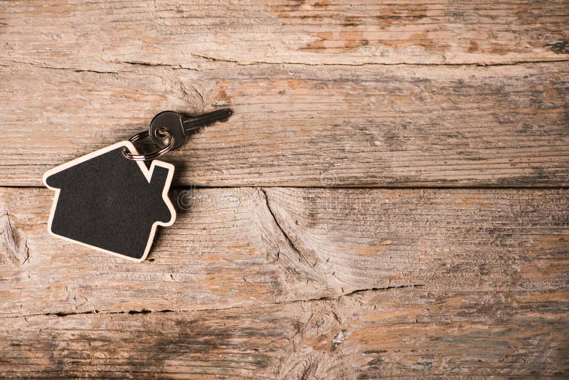 House-shaped Key on a Wood Table Stock Image - Image of landlord ...