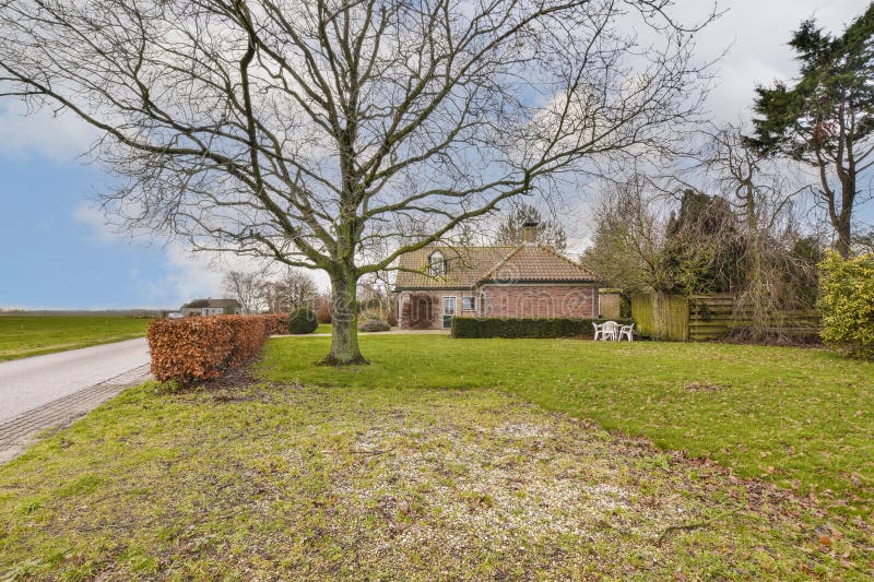 A House on the Side of a Road with a Stock Photo - Image of autumn ...