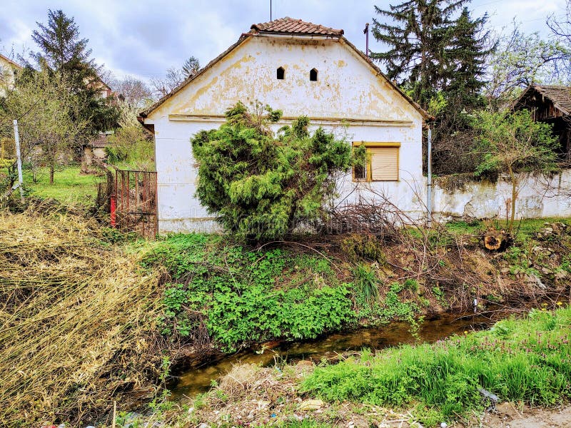 House in the Small Village Against Little Stream Stock Photo - Image of ...