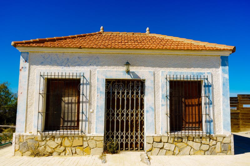 House with Steel Grid on Door and Windows Stock Photo - Image of ...