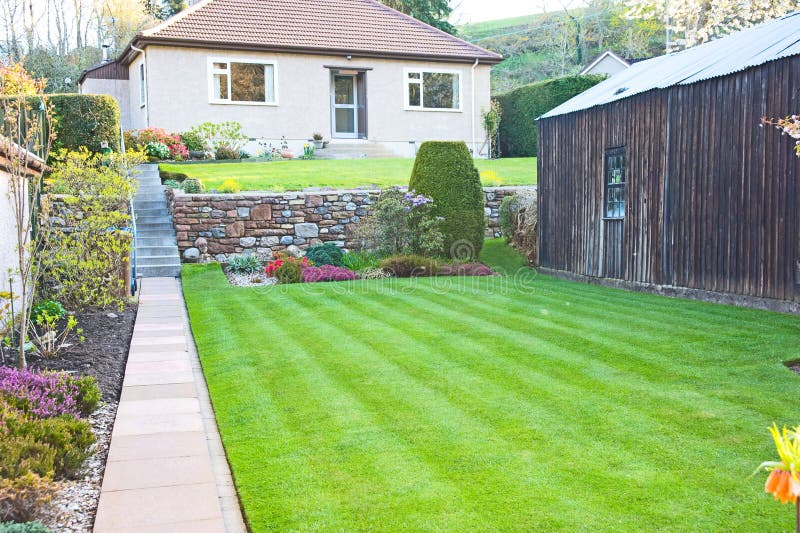 House and striped lawn stock image. Image of home, grass - 25431721