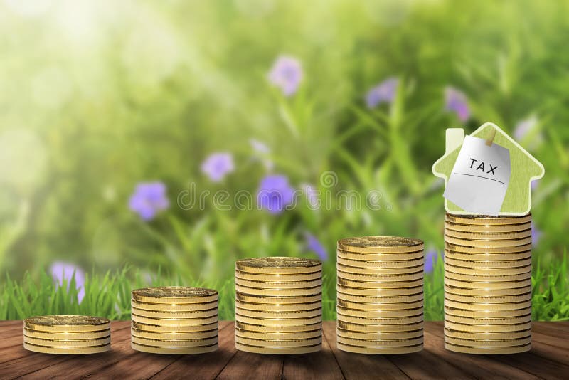House with Tax Notes on the Stack of Coins Stock Photo - Image of ...