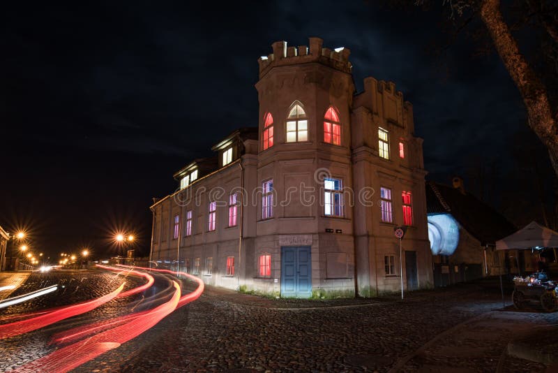 House with a Tower with Lights on the Windows in Different Colors. Day ...