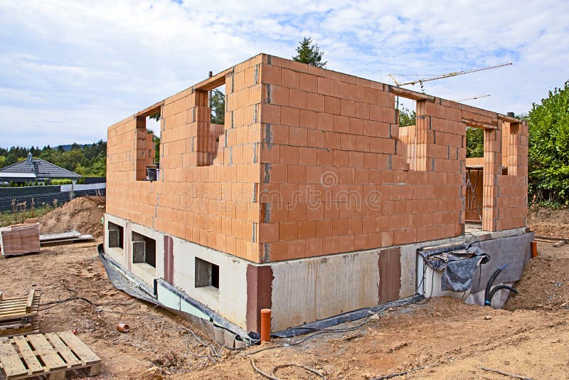 House Under Construction with Cellar and Red Wall Stones To Built the ...