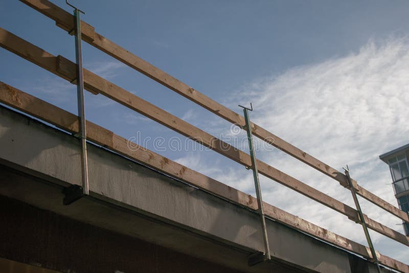House Under Renovation with Railing for Construction Site on the Facade ...