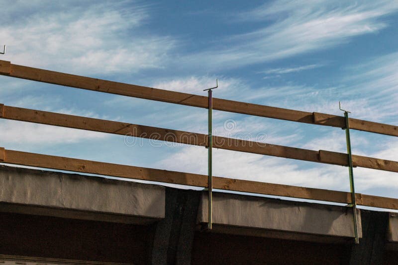 House Under Renovation with Railing for Construction Site on the Facade ...