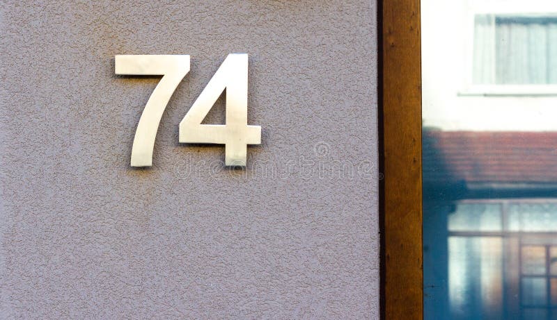 Bold steel house number 74 stock photo. Image of bold - 169526822