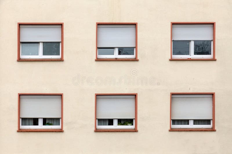 House Wall with Windows with Partly Closed Plastic Shutter Stock Photo ...