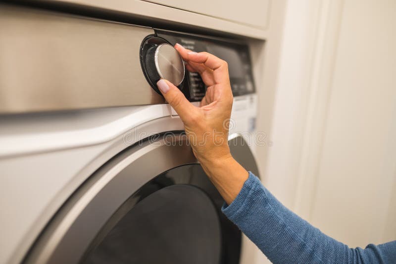 House Wife Preparing a Washing Machine for Clothes Washing Stock Photo ...
