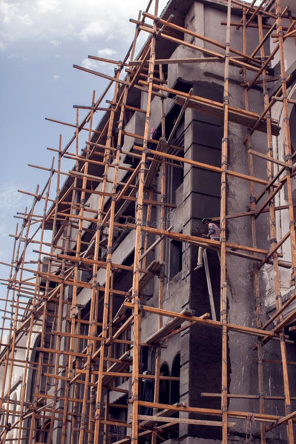 House with Wooden Scaffolding Construction. Architecture and Building ...