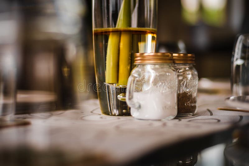 Table Decorations Sit on a Shiny Glass Table. Stock Image - Image of ...