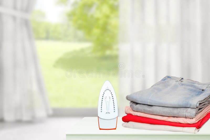 A Stack of Ironed and Folded Clothes Stock Photo - Image of cotton ...