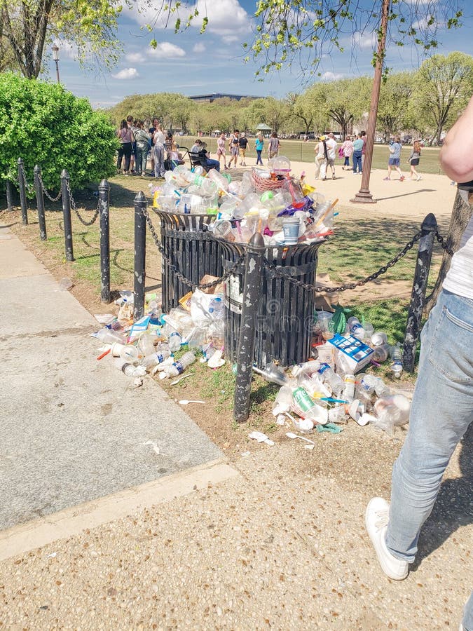 Household Waste and Garbage Spills Out Onto the Sidewalk from Garbage ...