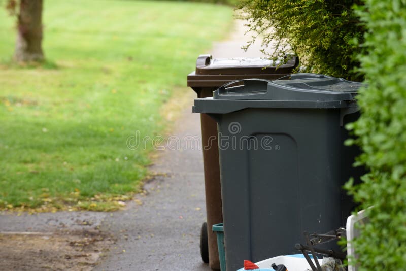 Household Waste and Recycling Bins Ready for Collection Outside a Home ...