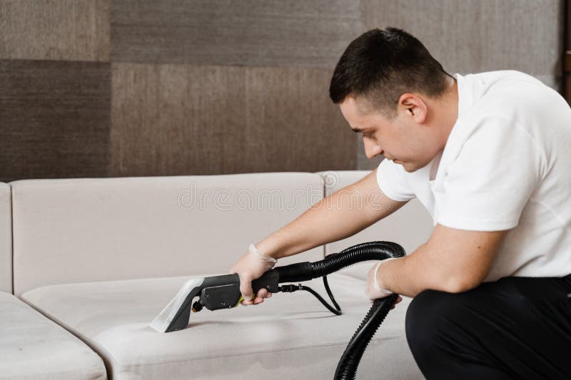 Housekeeper is Extracting Dirt from Upholstered Sofa Using Dry Cleaning ...