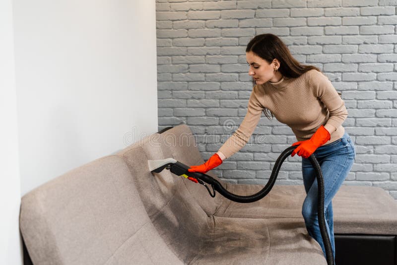 Housekeeper is Extracting Dirt from Upholstered Sofa Using Dry Cleaning ...