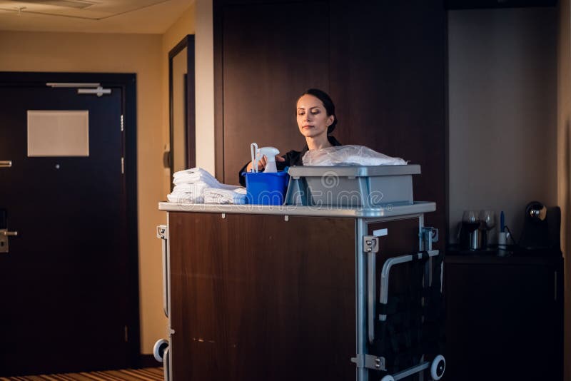 A Housekeeping Lady in a Uniform Cleaning the Room Stock Image - Image ...
