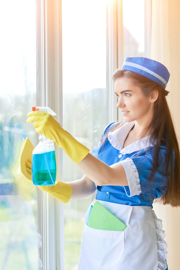 Housemaid at work smiling. stock photo. Image of clean - 111530610