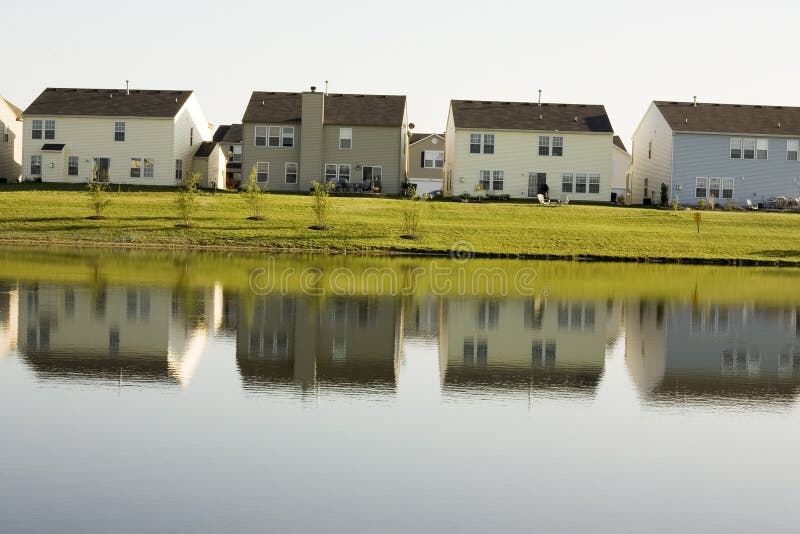 Houses on lake stock image. Image of subdivision, home - 2449681
