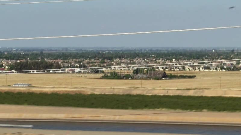 Houses and Open Fields Gray Sky Handheld from Moving Car Stock Video ...
